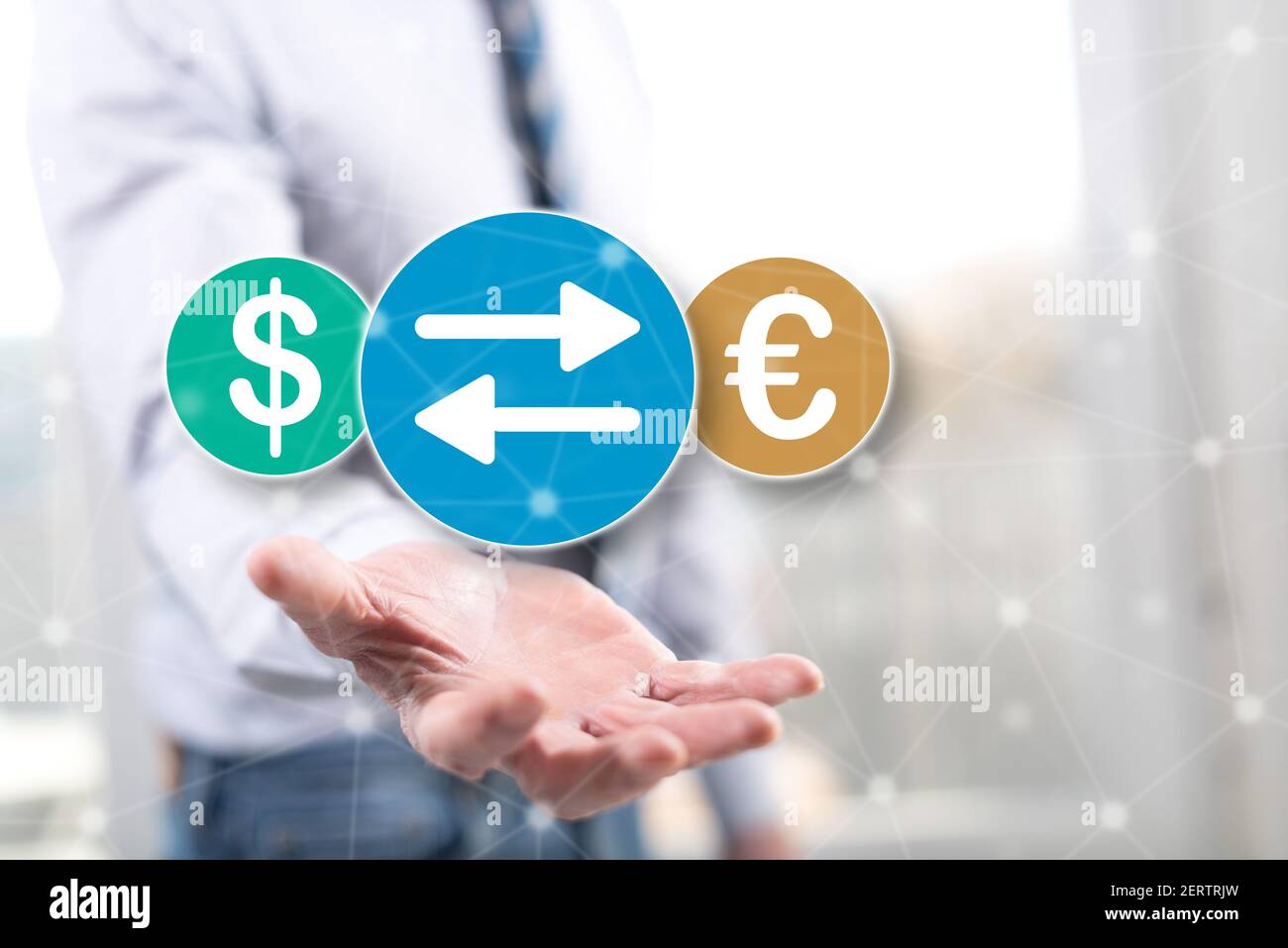 Currency exchange concept above the hand of a man in background Stock ...