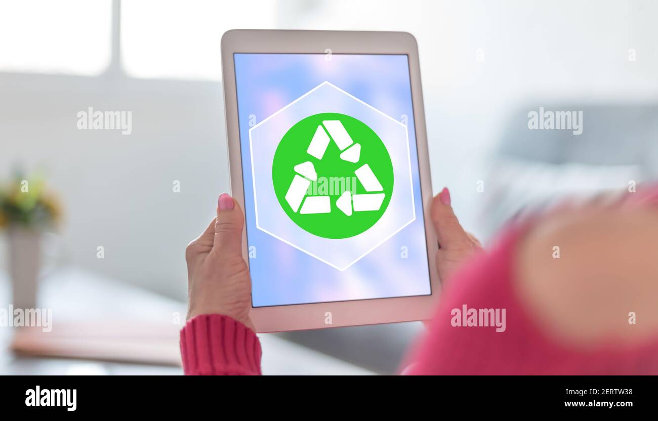 Tablet screen displaying a recycling concept Stock Photo - Alamy