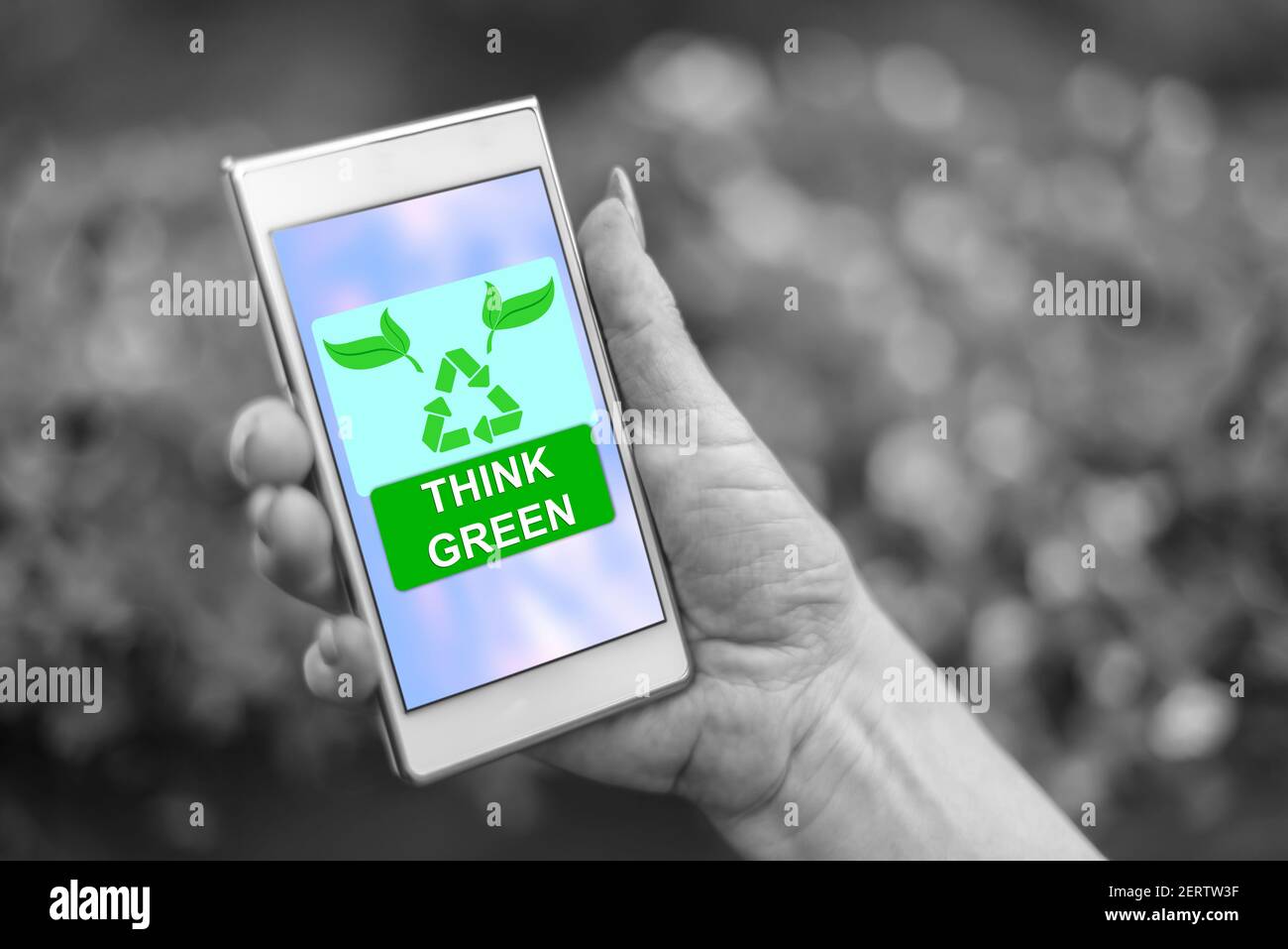 Female hand holding a smartphone with think green concept Stock Photo ... Female hand holding a smartphone with think green concept Stock Photo ...
