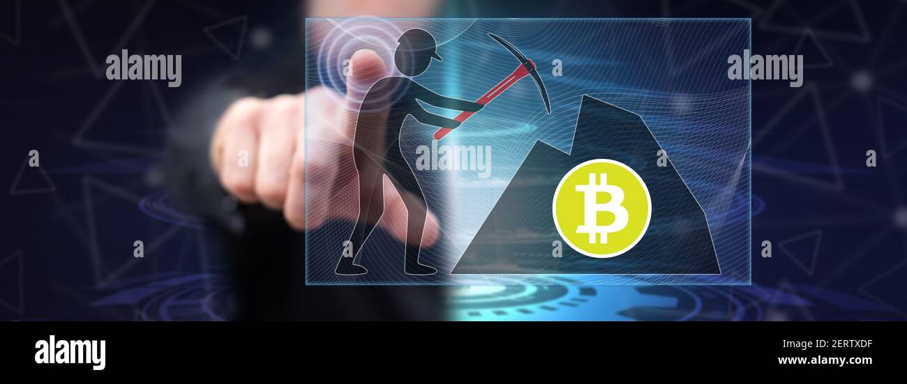 Man touching a bitcoin mining concept on a touch screen with his finger ...
