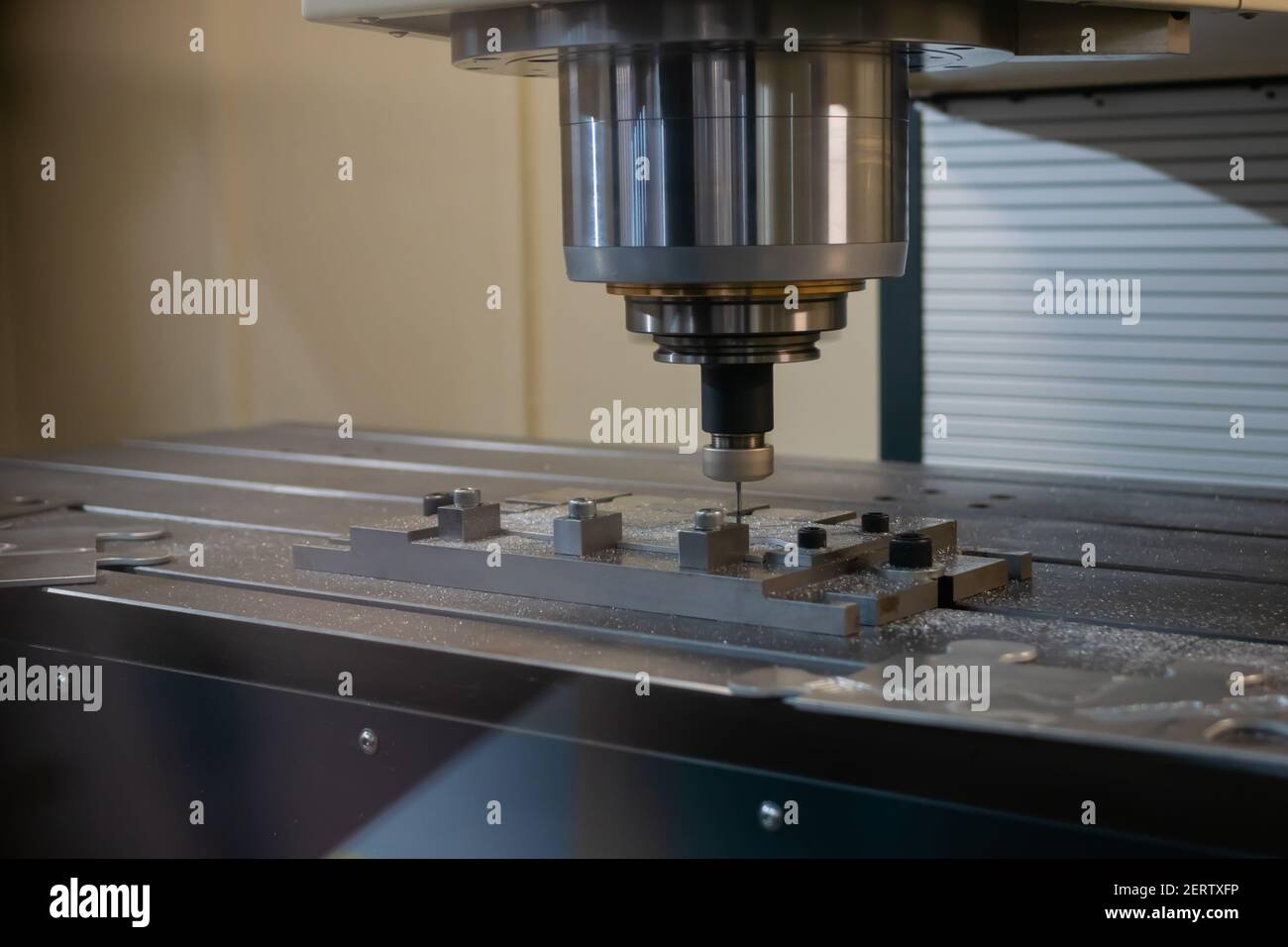 Turning milling machine cutting metal workpiece at factory at factory ...