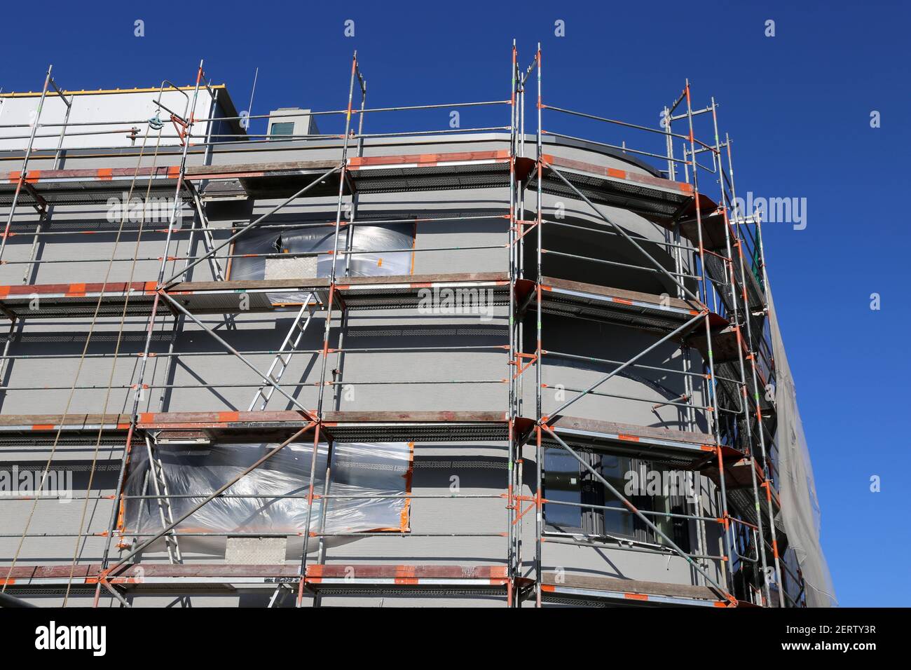 New building with just finished facade painting Stock Photo - Alamy