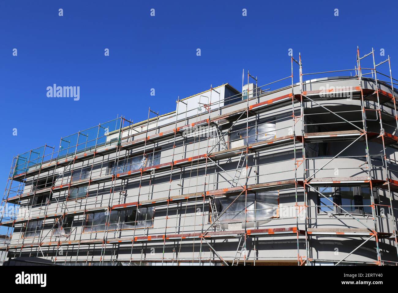 New building with just finished facade painting Stock Photo - Alamy