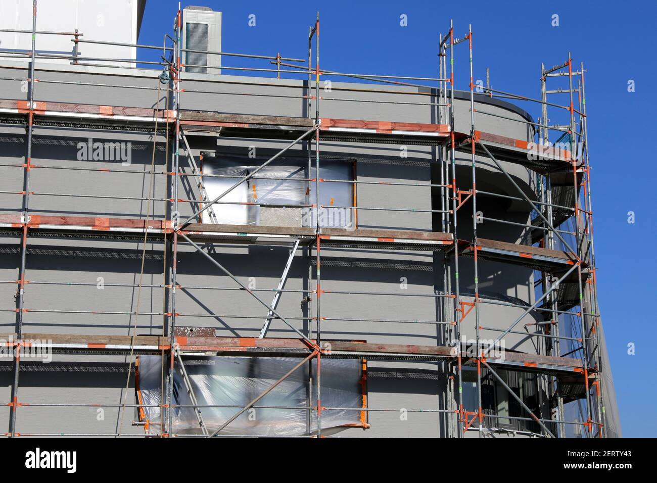 New building with just finished facade painting Stock Photo - Alamy