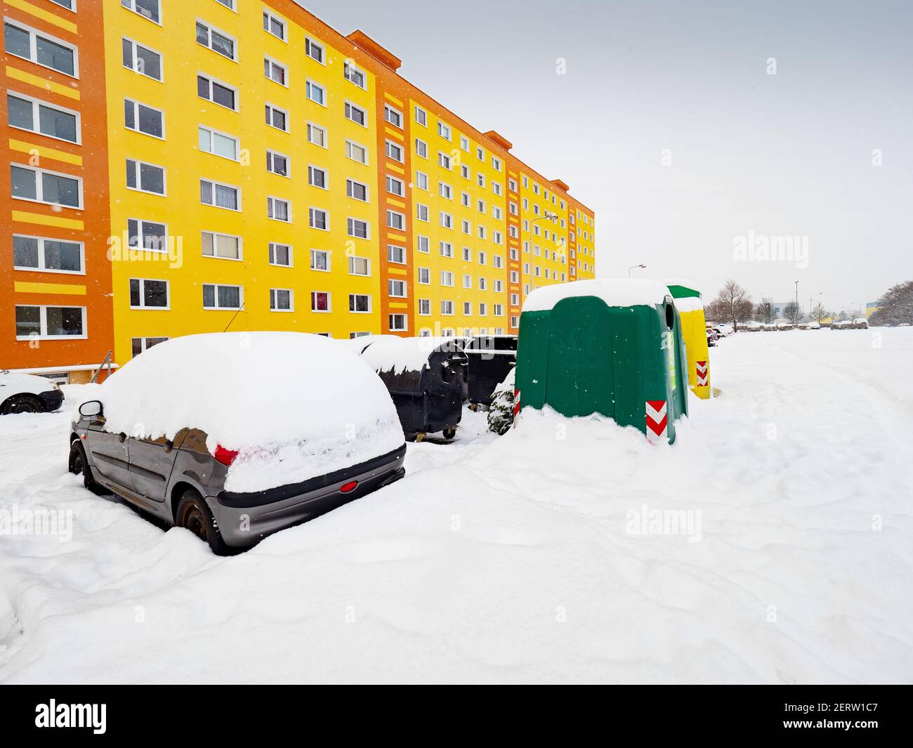Garbage cans and containers for sorted waste on the edge of the parking ...