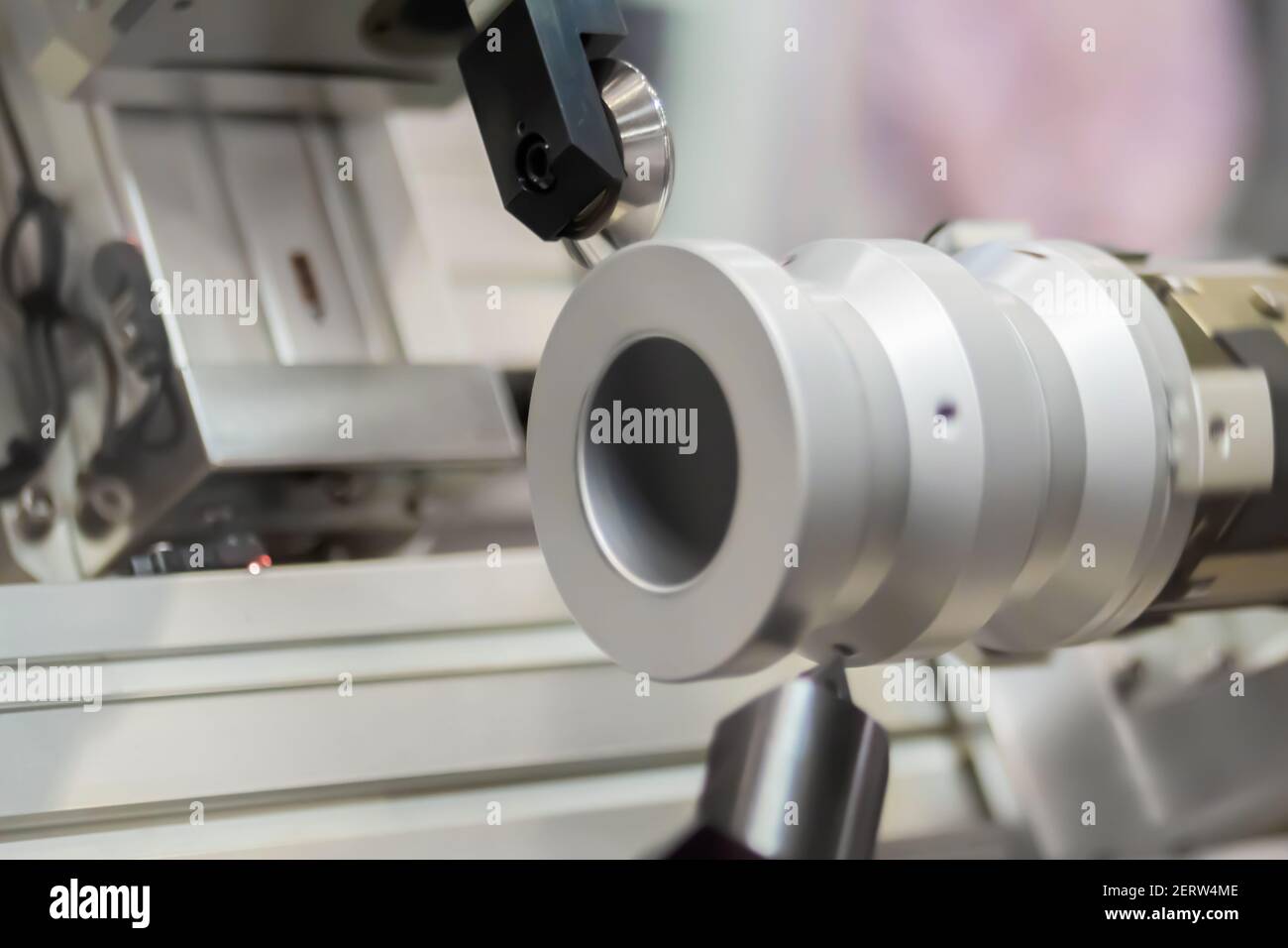 Automated cnc turning milling machine cutting metal workpiece at ...