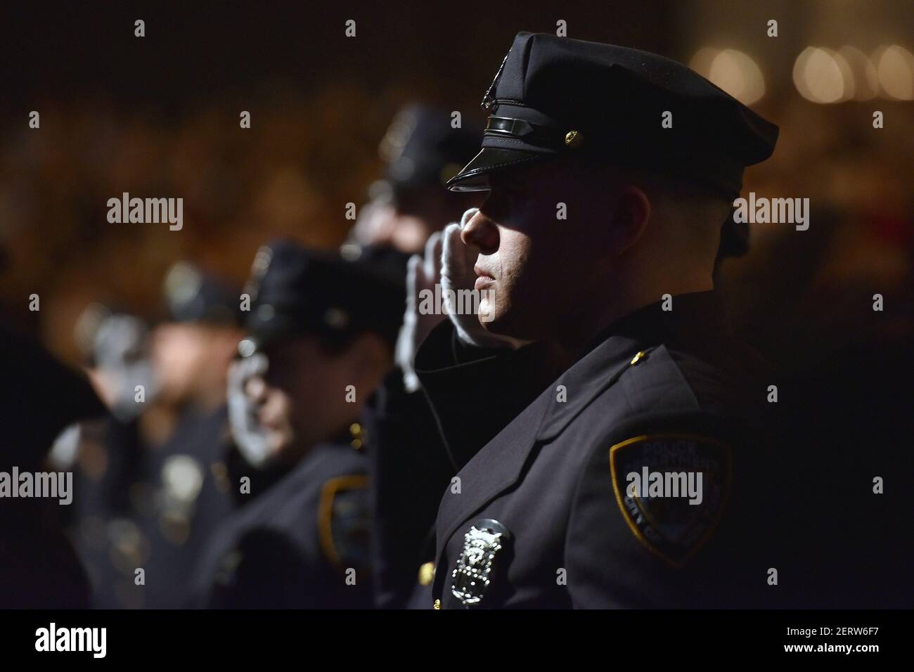 New members of the New York City Police Department (NYPD) stand at ...