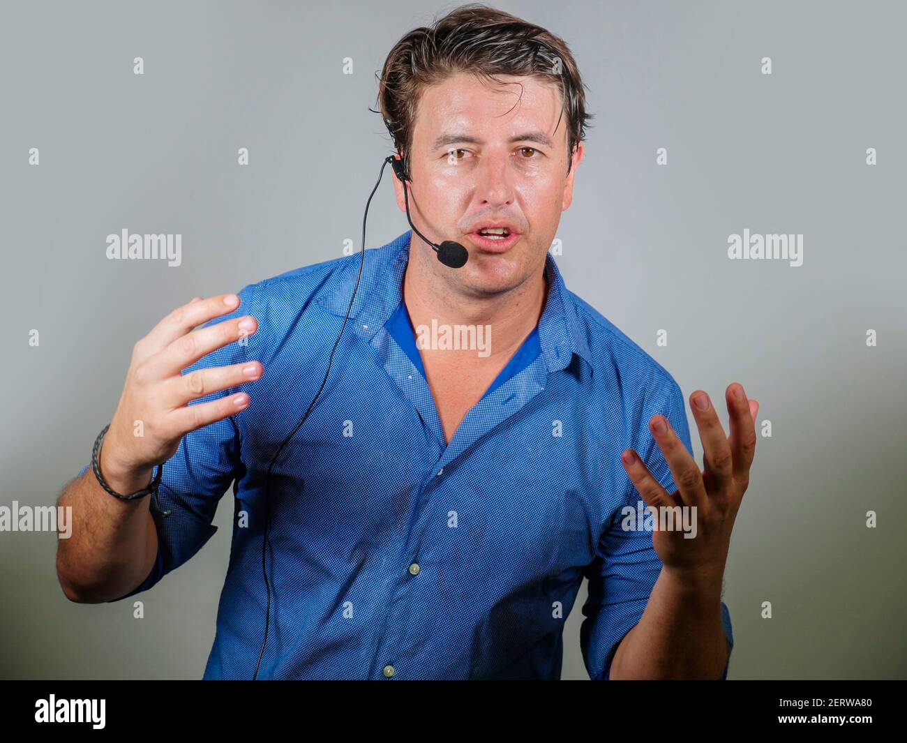 Man speaking through microphone in hi-res stock photography and images ...