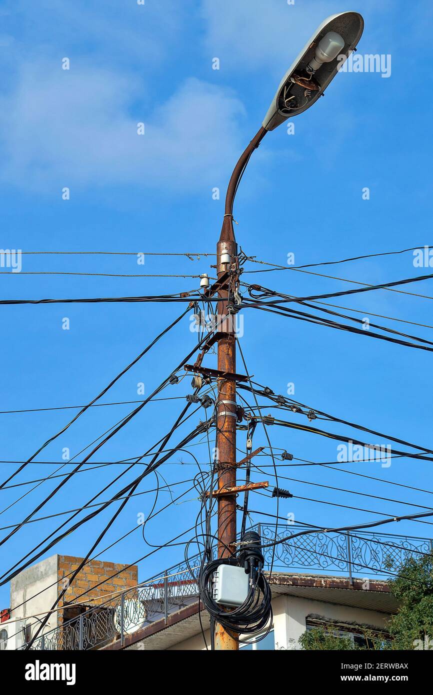 A lamppost with lots of wires. A sunny autumn day is a side view Stock ...