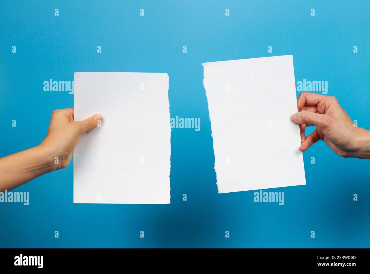 Tearing paper hands hi-res stock photography and images - Alamy