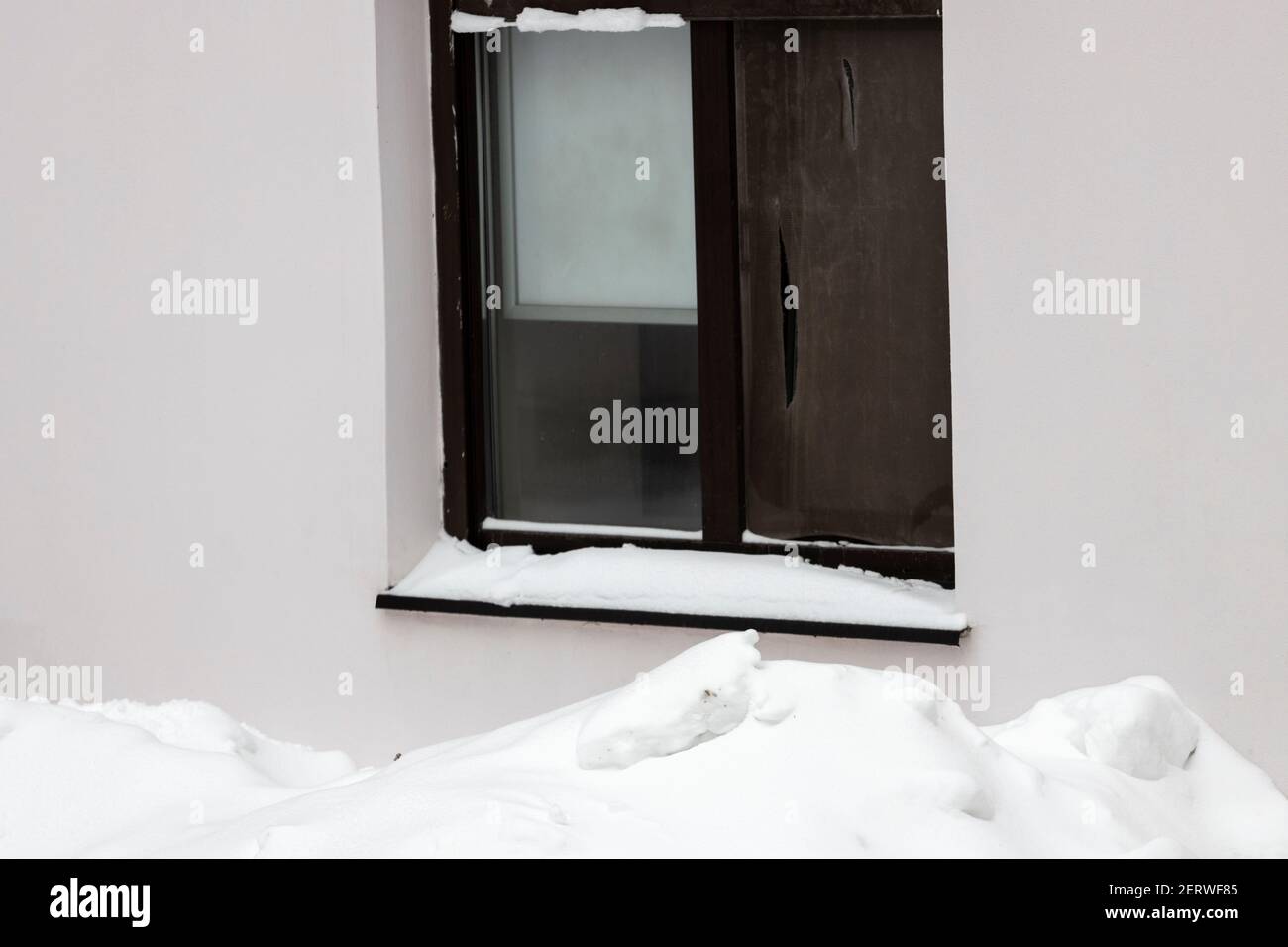 pile of snow at the window of an apartment building. High quality photo ...