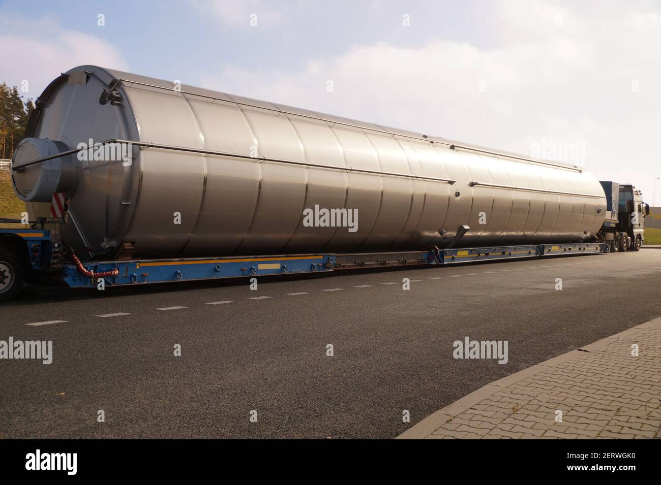 A truck with a special semi-trailer for transporting oversized loads. Oversize load or ...