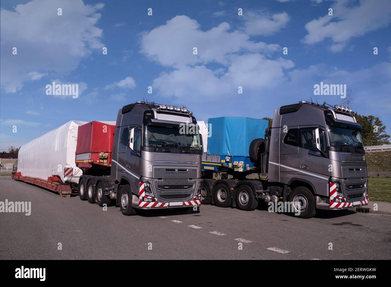 A truck with a special semi-trailer for transporting oversized loads. Oversize load or ...