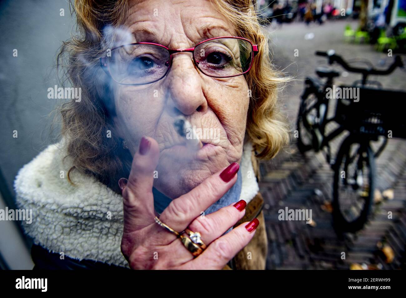 People smoking on the streets Amsterdam, Netherlands on October 18 ...