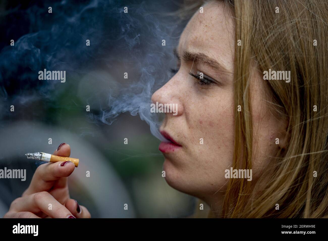 People smoking on the streets Amsterdam, Netherlands on October 18 ...