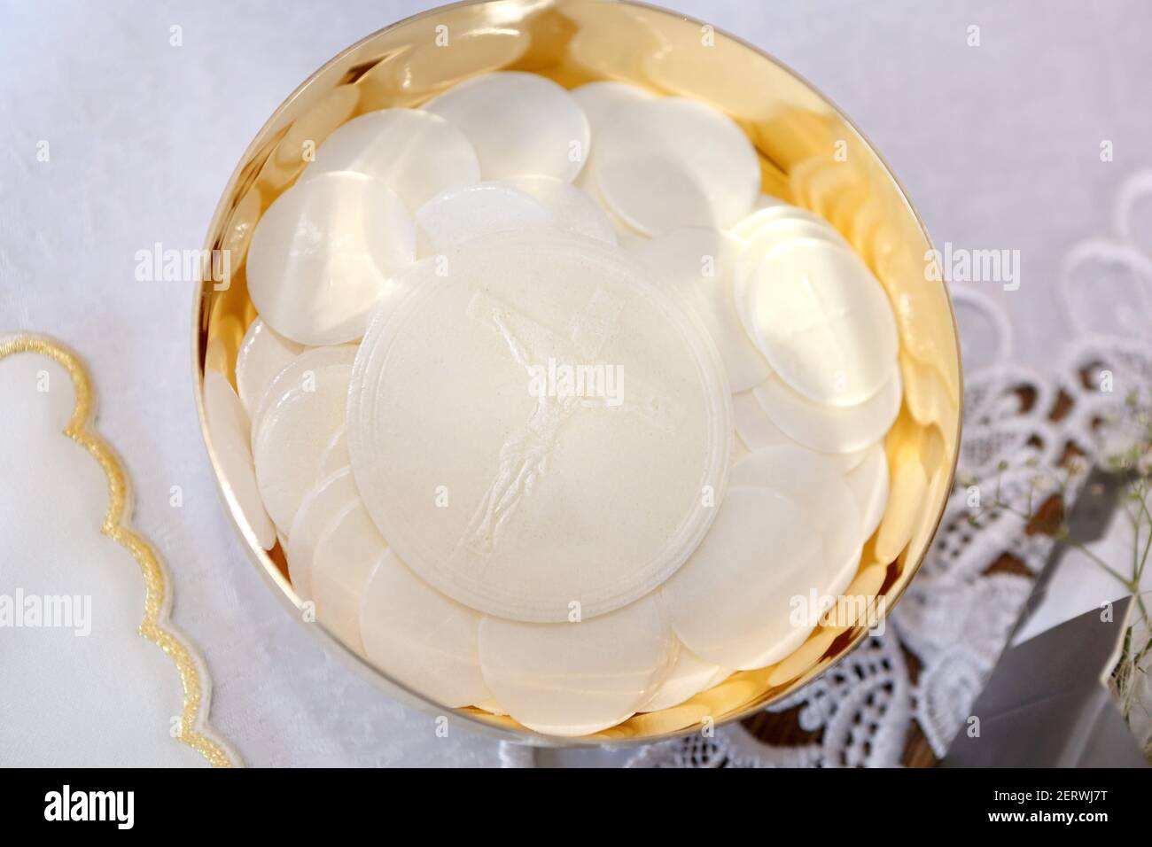 Holy host in the chalice on the altar during the celebration of the ...