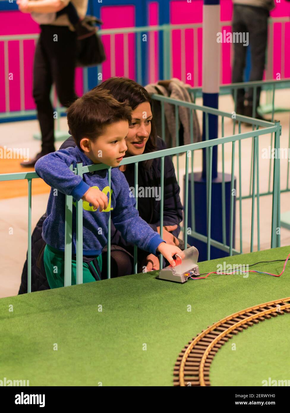 POZNAN, POLAND - Jan 27, 2018: Woman and young boy steering something ...