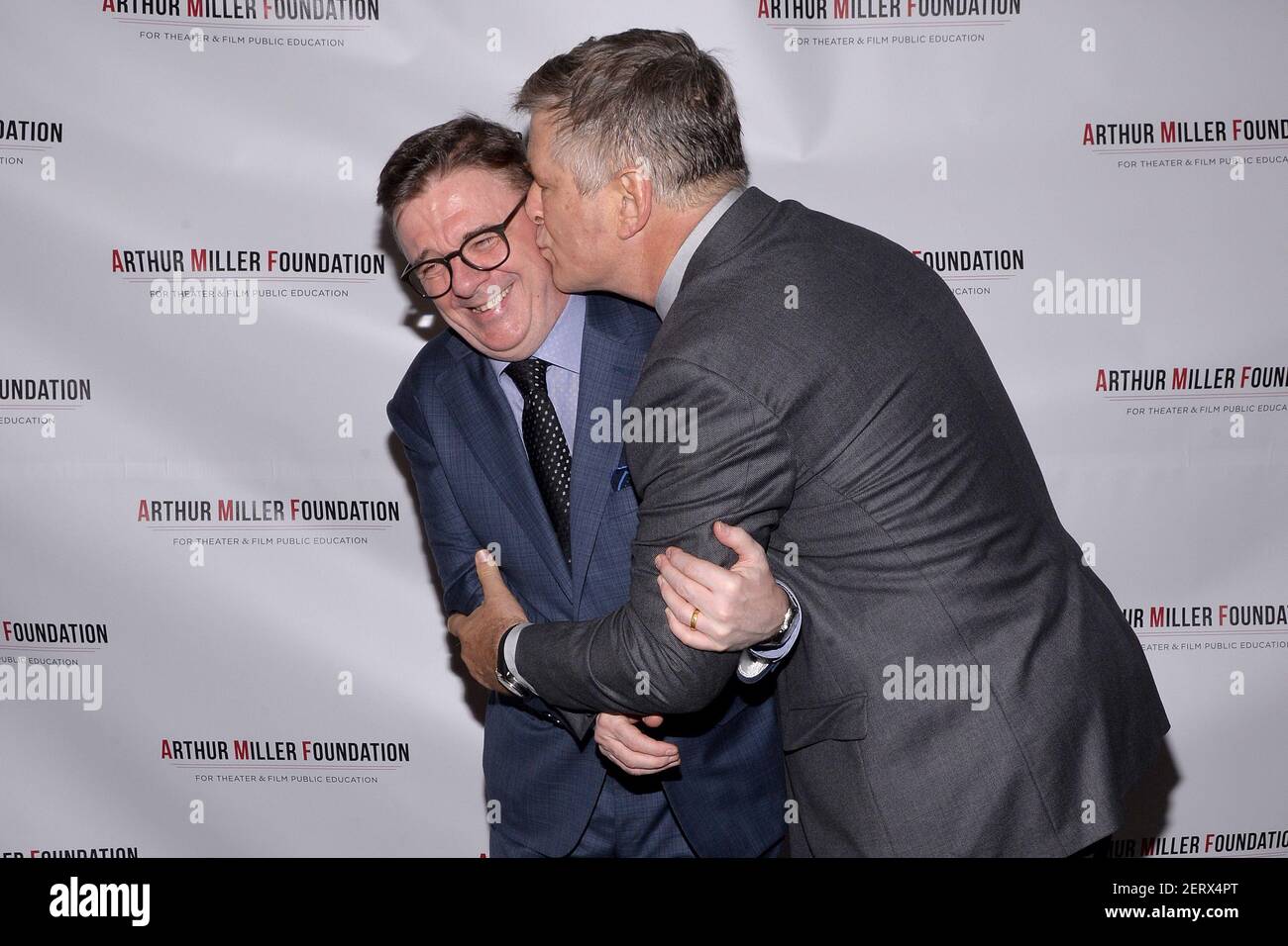 (L-R) Nathan Lane is kissed by Alec Baldwin during arrivals as they ...