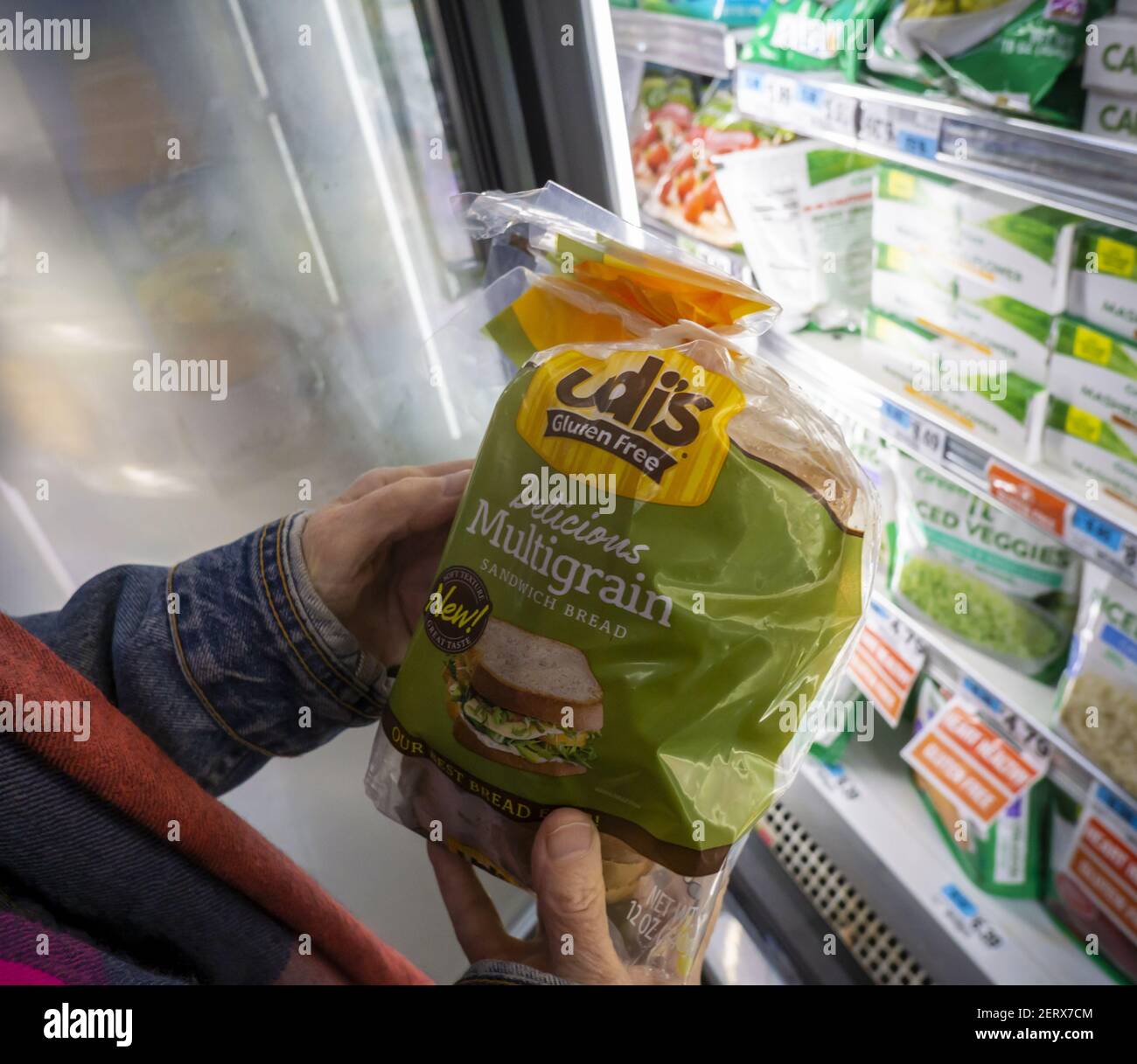 A shopper chooses a package of Pinnacle Foods brand Udi's gluten-free ...
