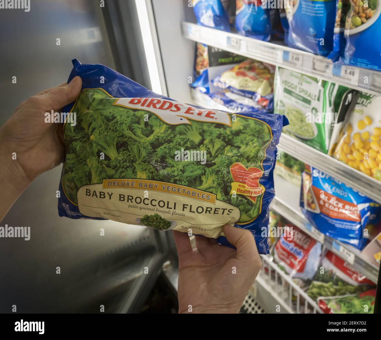 A shopper chooses a package of Pinnacle Foods brand Birds Eye frozen ...