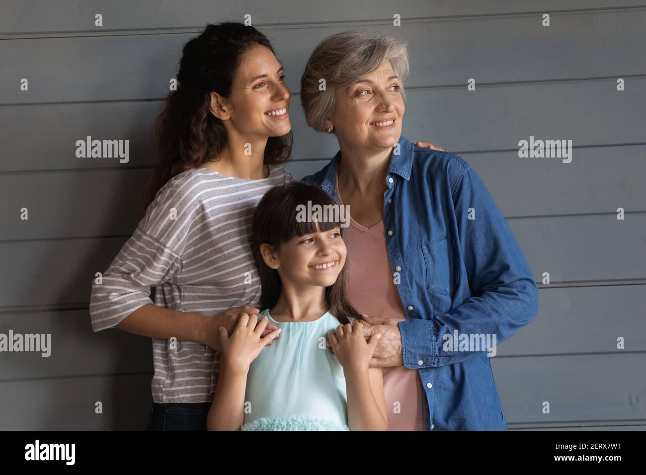 Happy three generations of Latino women look in distance Stock Photo ...