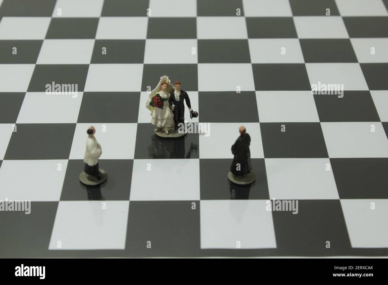 The wedding scene with bridal couple and priest on a chessboard Stock ...