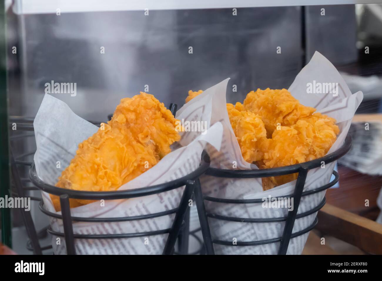 Fish wrapped in newspaper hi-res stock photography and images - Alamy