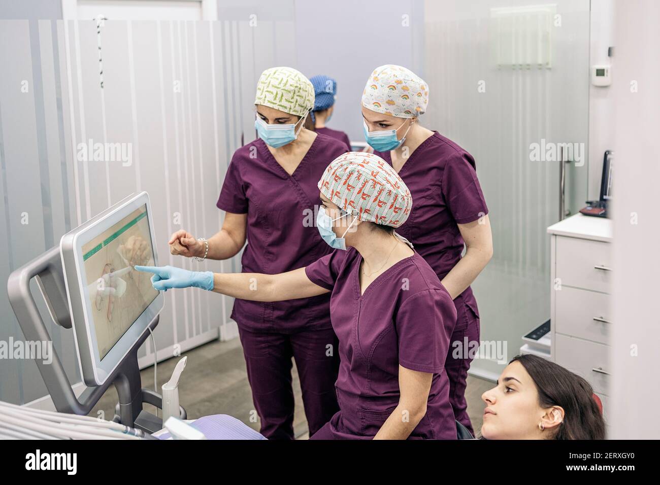 Stock photo of female work team in dental clinic examining a x-ray ...