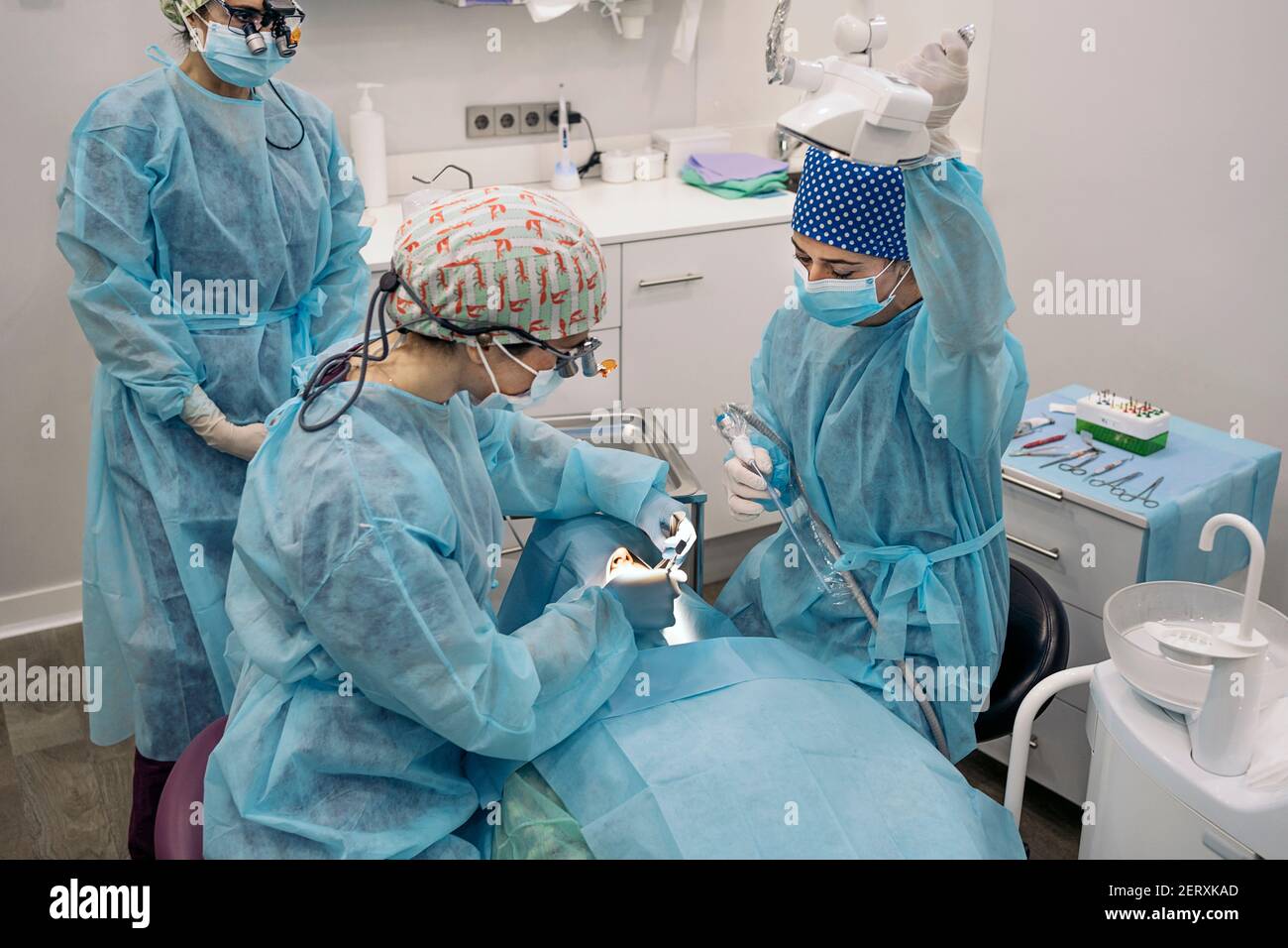 Stock photo of women team wearing face masks and hair nets working in ...
