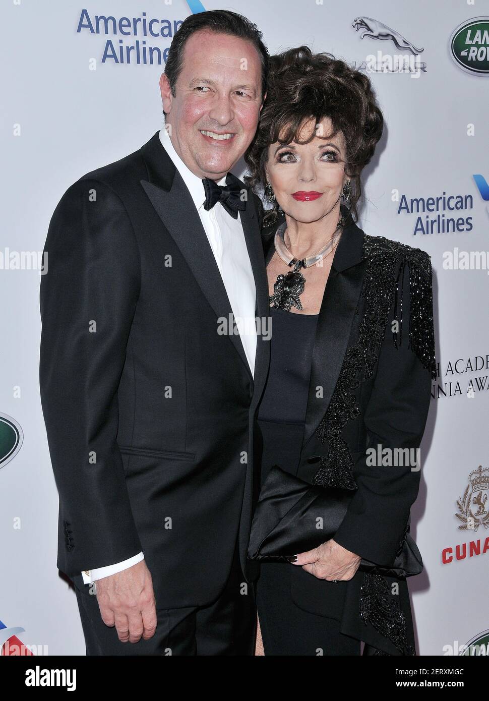 (L-R) Percy Gibson and Joan Collins arrives at the 2018 British Academy ...