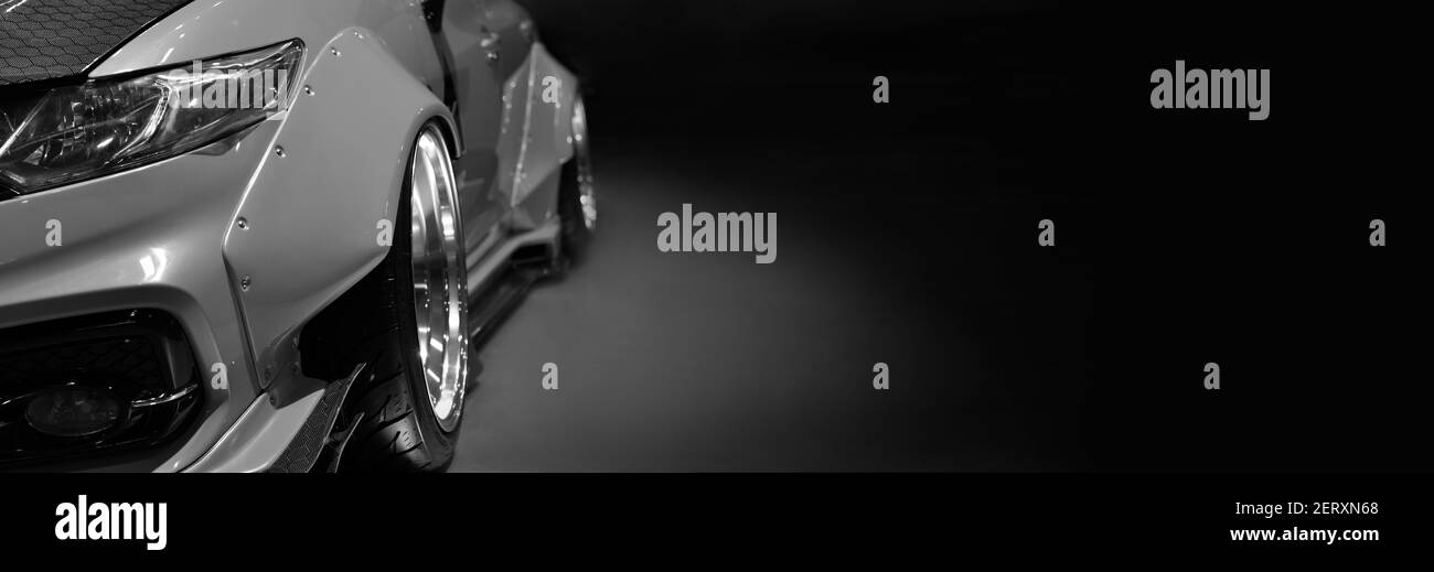 Front headlights modify car on black background, copy space Stock Photo ...