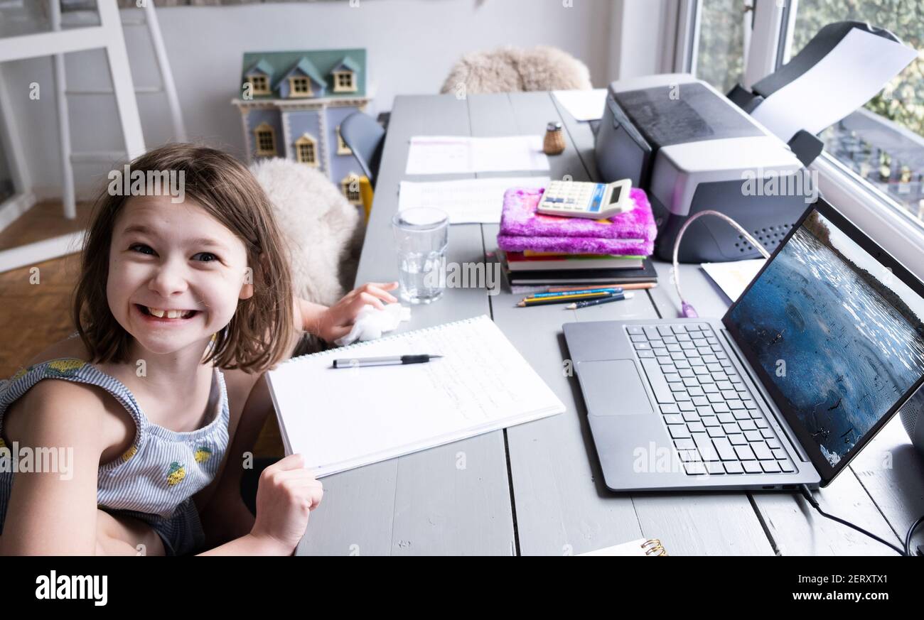 Small child doing home learning Stock Photo - Alamy