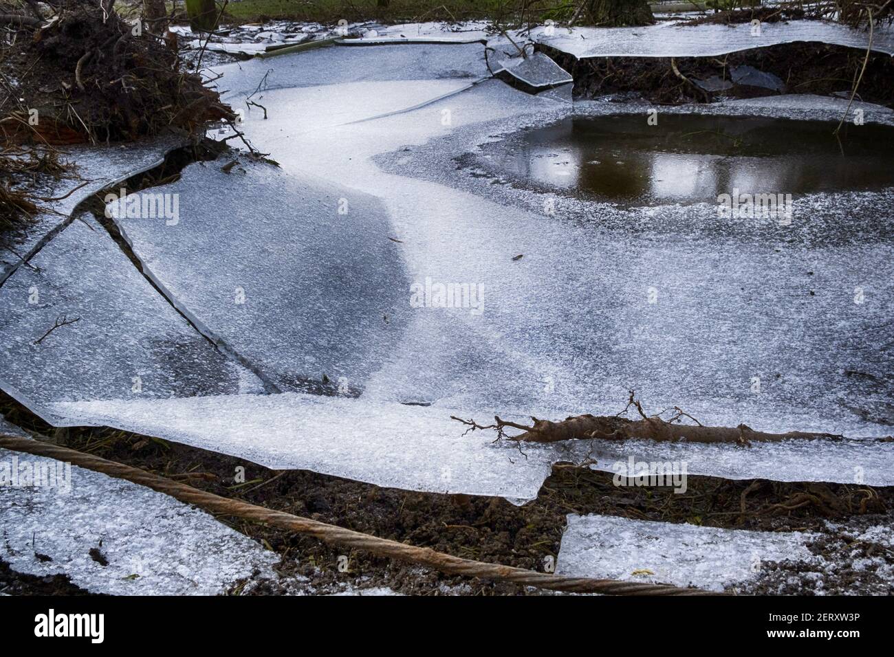 Broken pool of flood water Stock Photo - Alamy