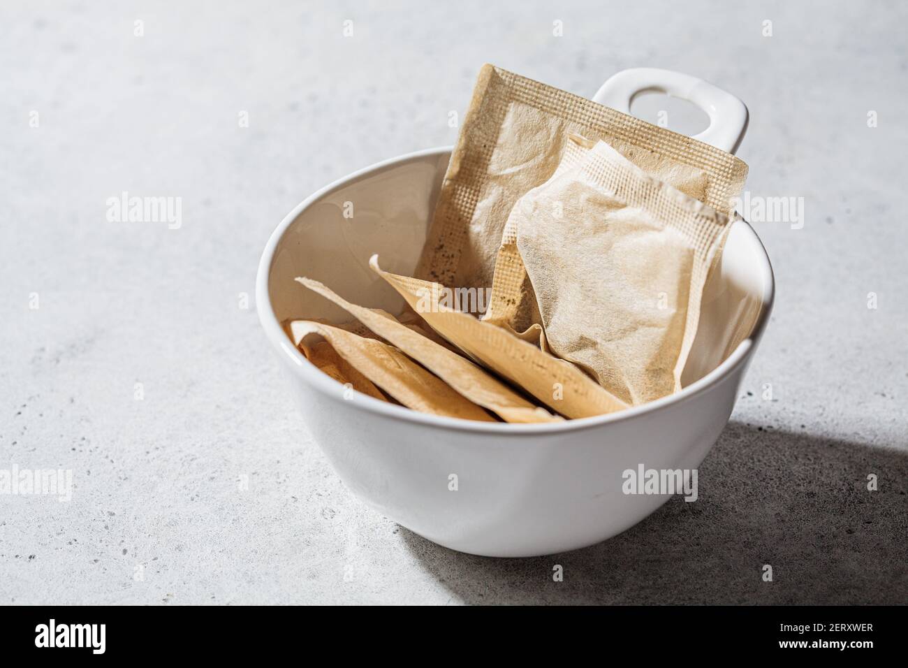 Dry herbal tea bags in a white bowl. Herbal tea concept Stock Photo - Alamy