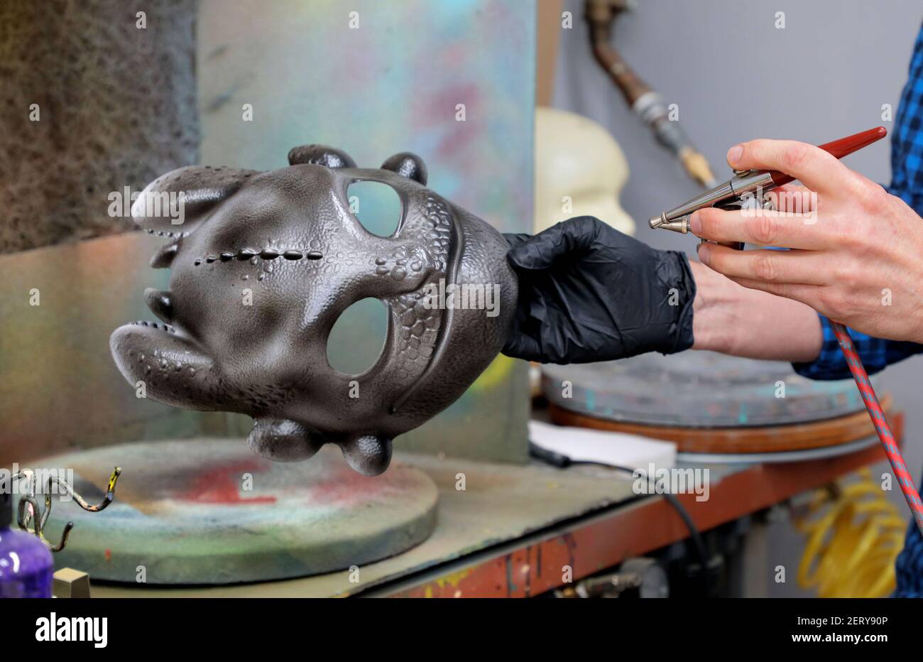 Detail view of a mask of "Toothless," a character from the movie How to ...