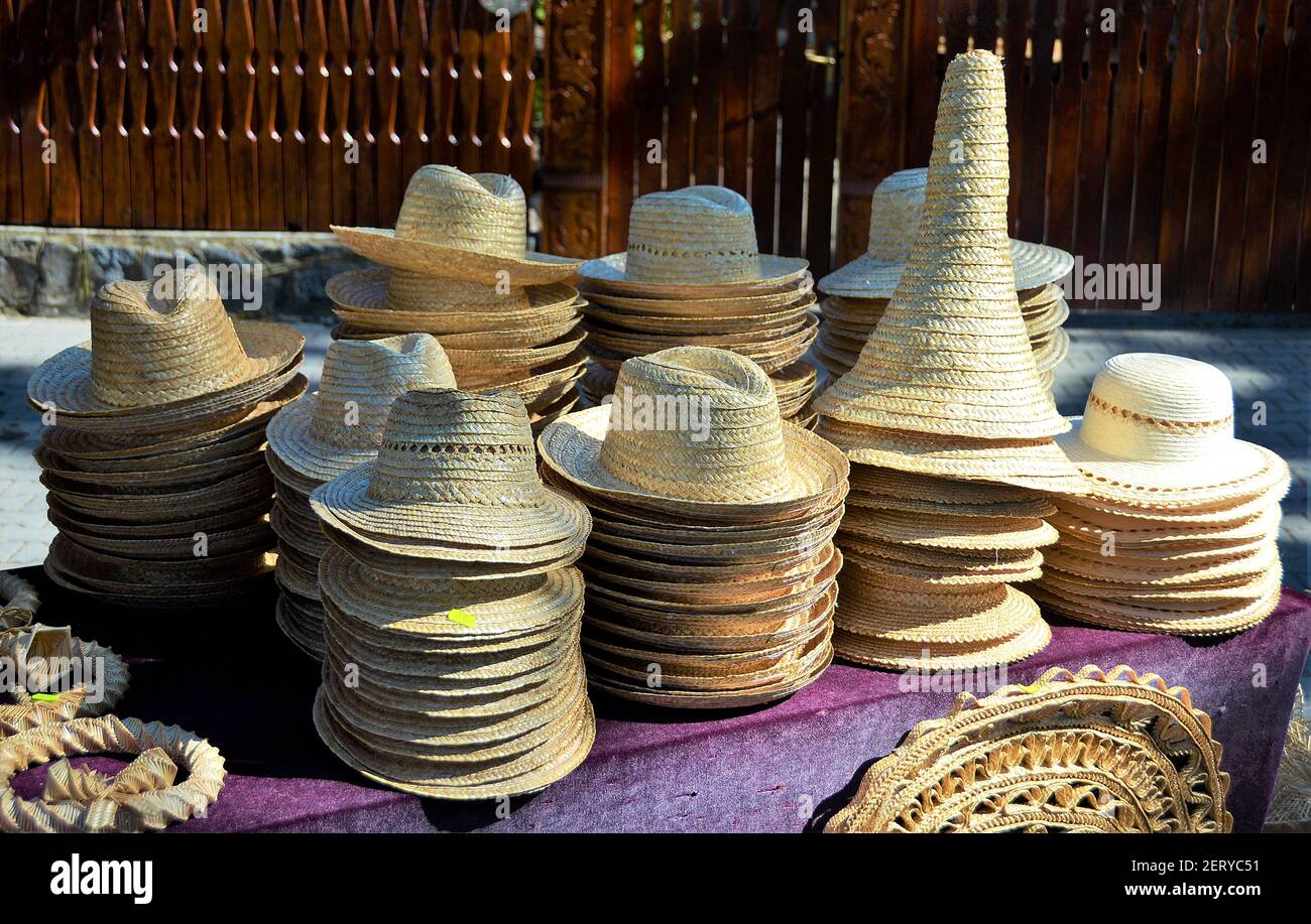 Stacked straw hats hi-res stock photography and images - Alamy