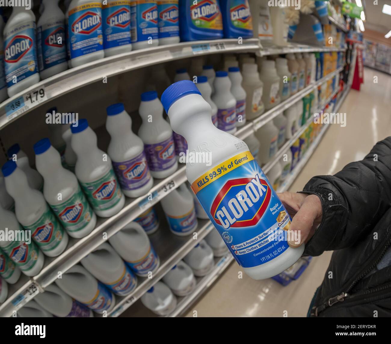 A shopper chooses a bottle of Clorox bleach in a supermarket in New ...
