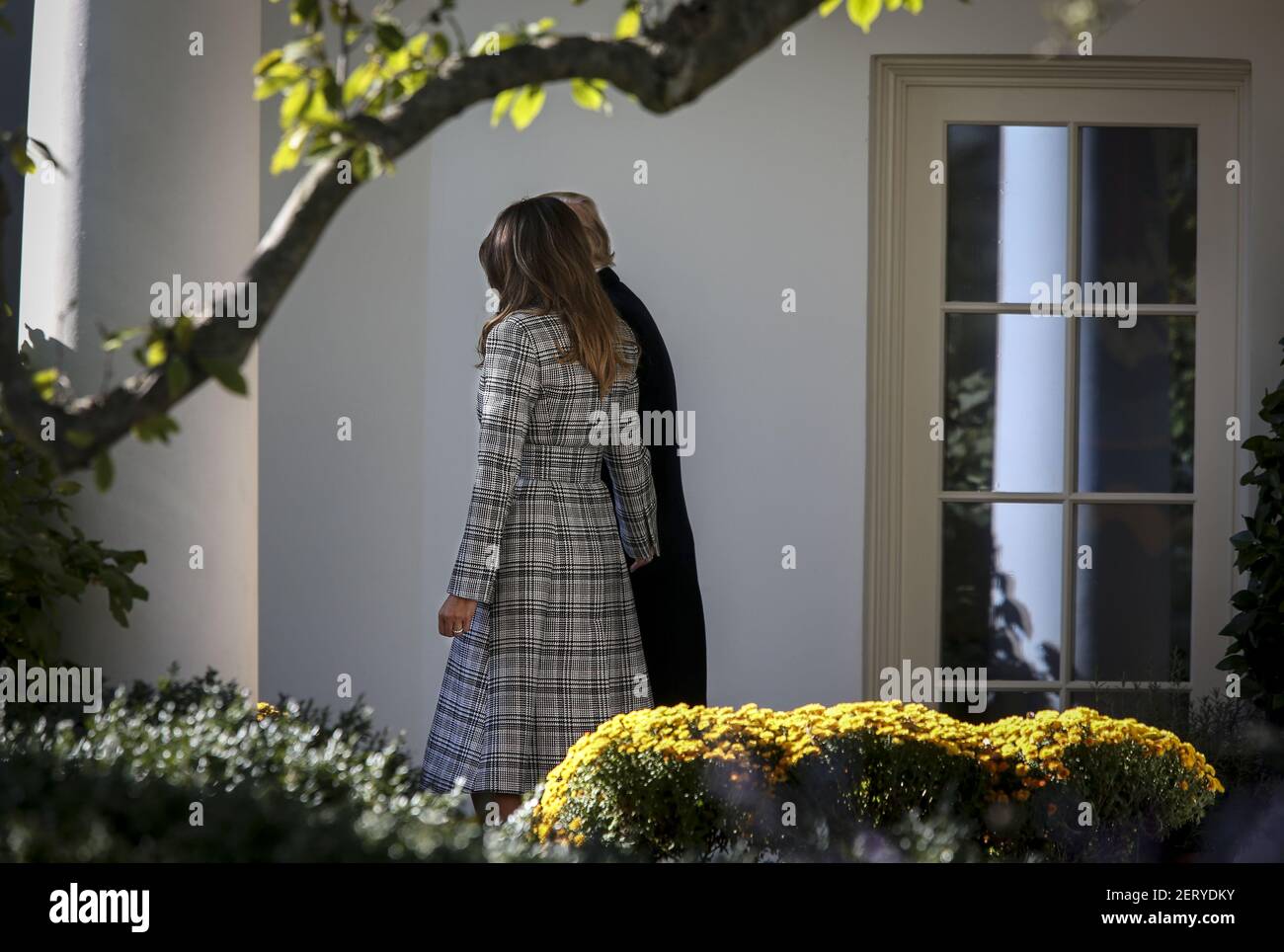President Donald Trump and first lady Melania Trump walk out of the ...