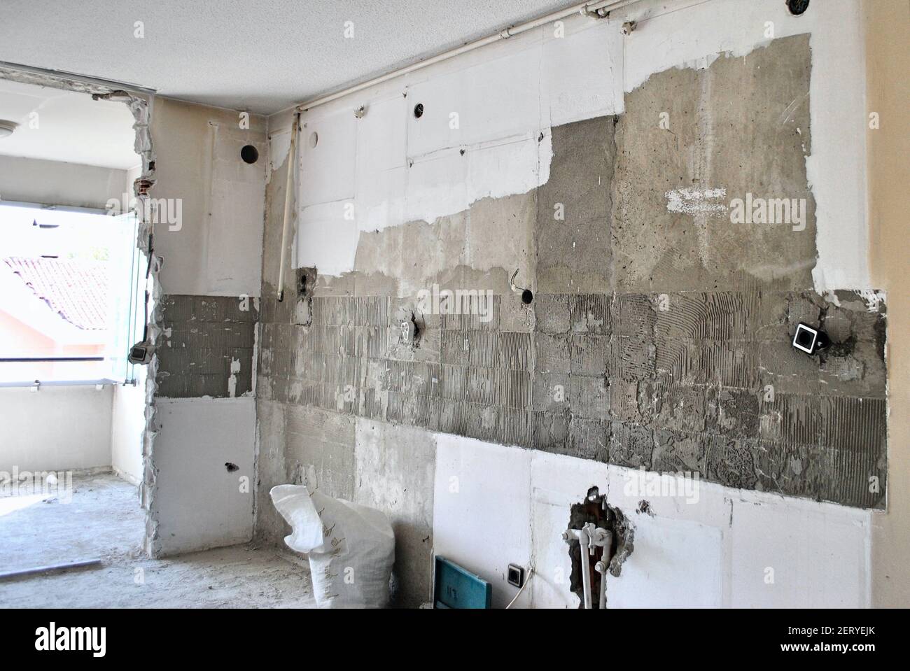 Kitchen wall during reconstruction work without door, tiles and tap ...