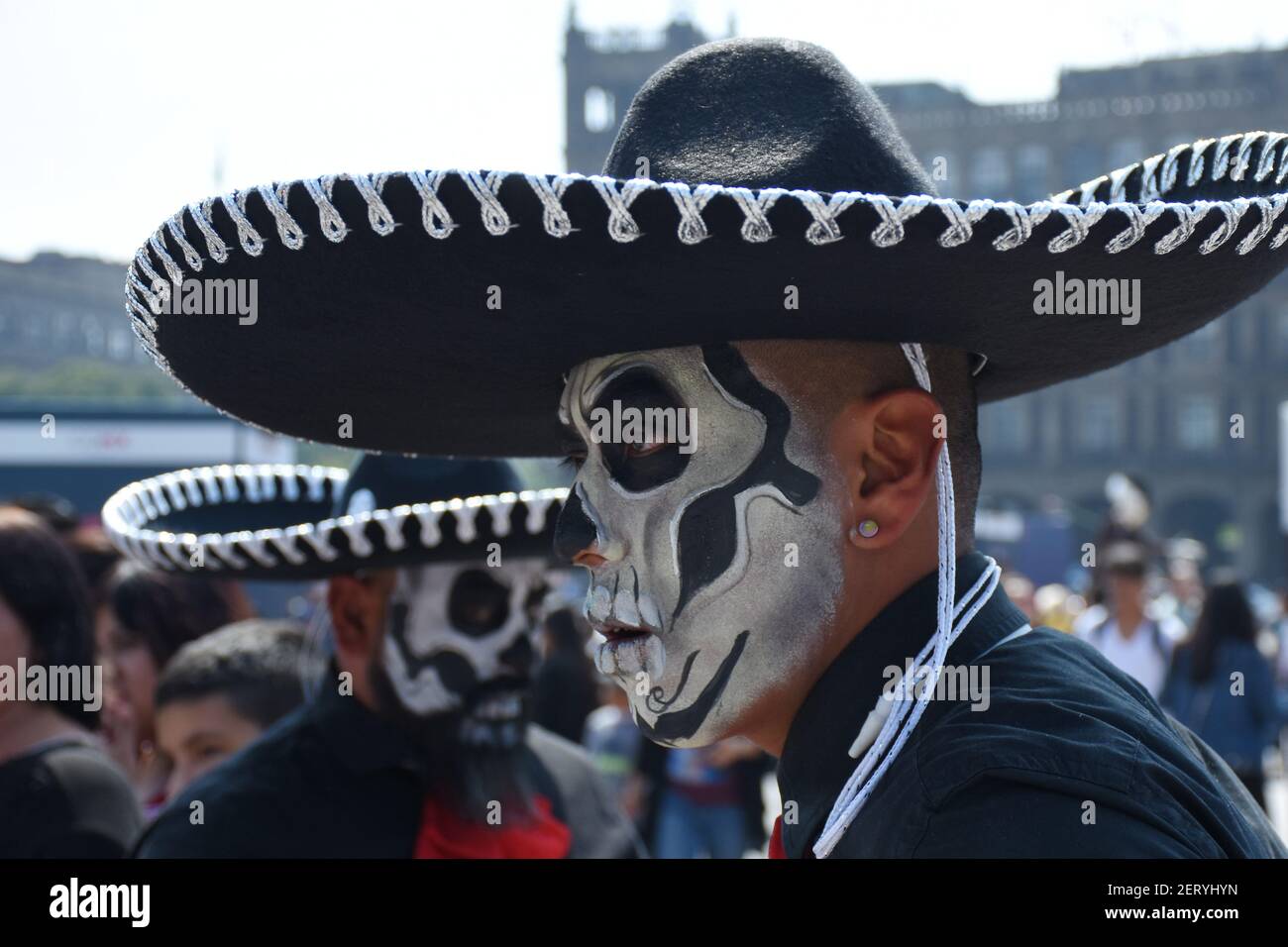 A Man dressed as Charro and the face painted as a skull looks during ...