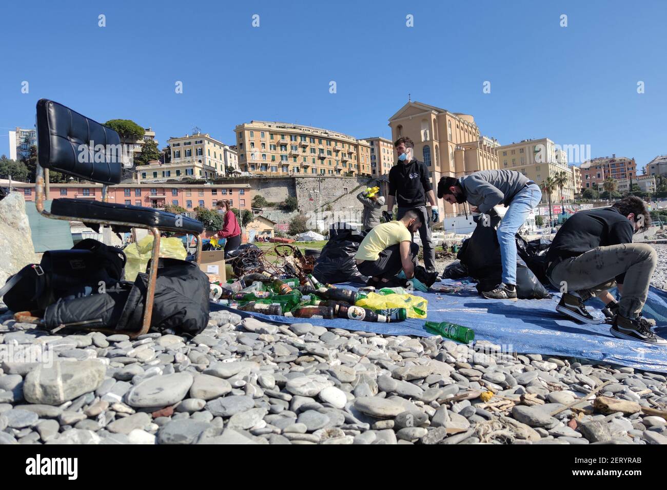 GENOA, ITALY - FEBRUARY 28 2021 - Young volunteers collect plastic and ...
