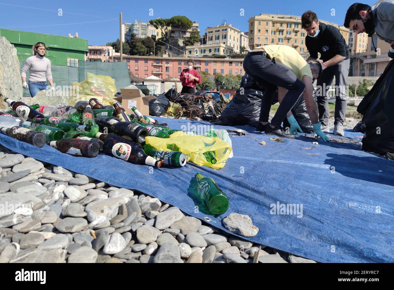 GENOA, ITALY - FEBRUARY 28 2021 - Young volunteers collect plastic and ...