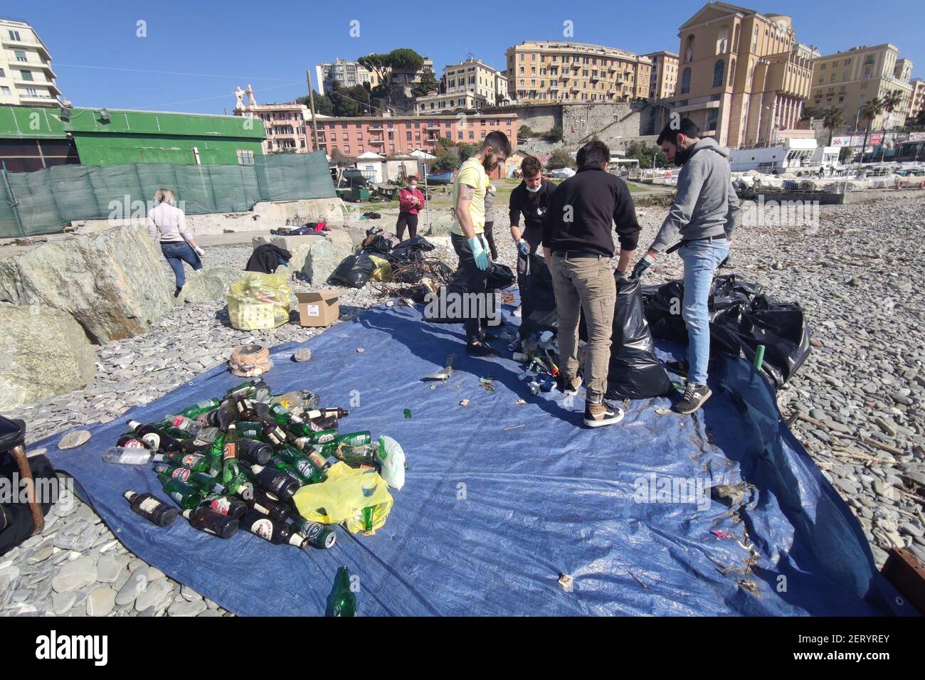 GENOA, ITALY - FEBRUARY 28 2021 - Young volunteers collect plastic and ...