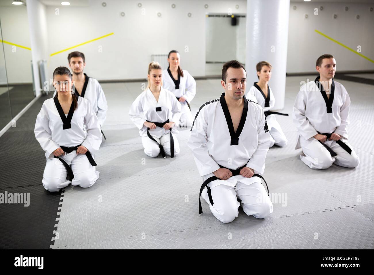 Martial artists wearing black belt, taekwondo and para-taekwondo ...