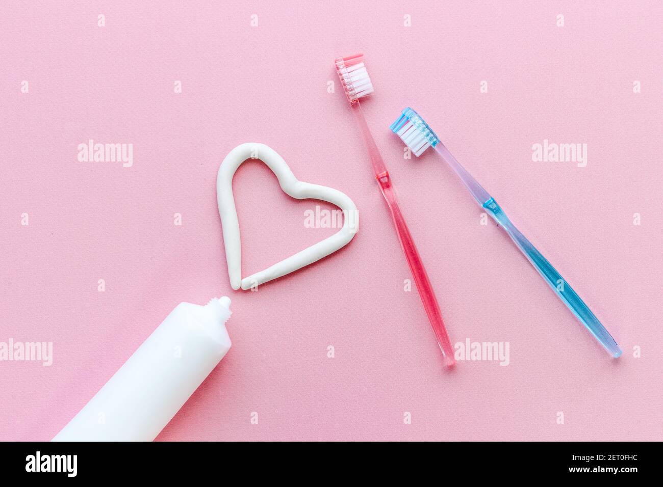 Teeth hygiene. Toothbrush with heart shape made of toothpaste, top view ...