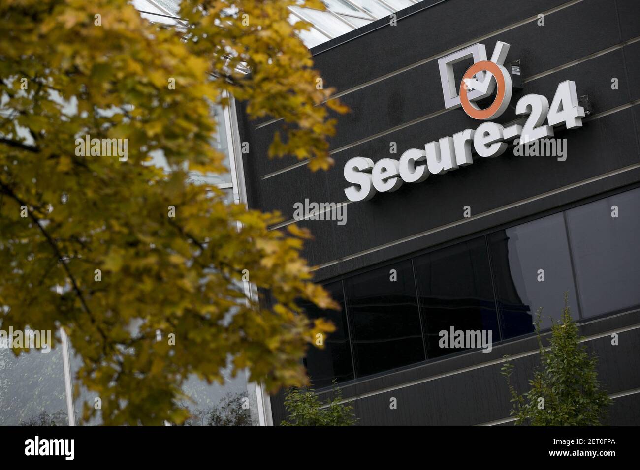 A logo sign outside of the headquarters of Secure-24, Inc., in Southfield, Michigan on October ...