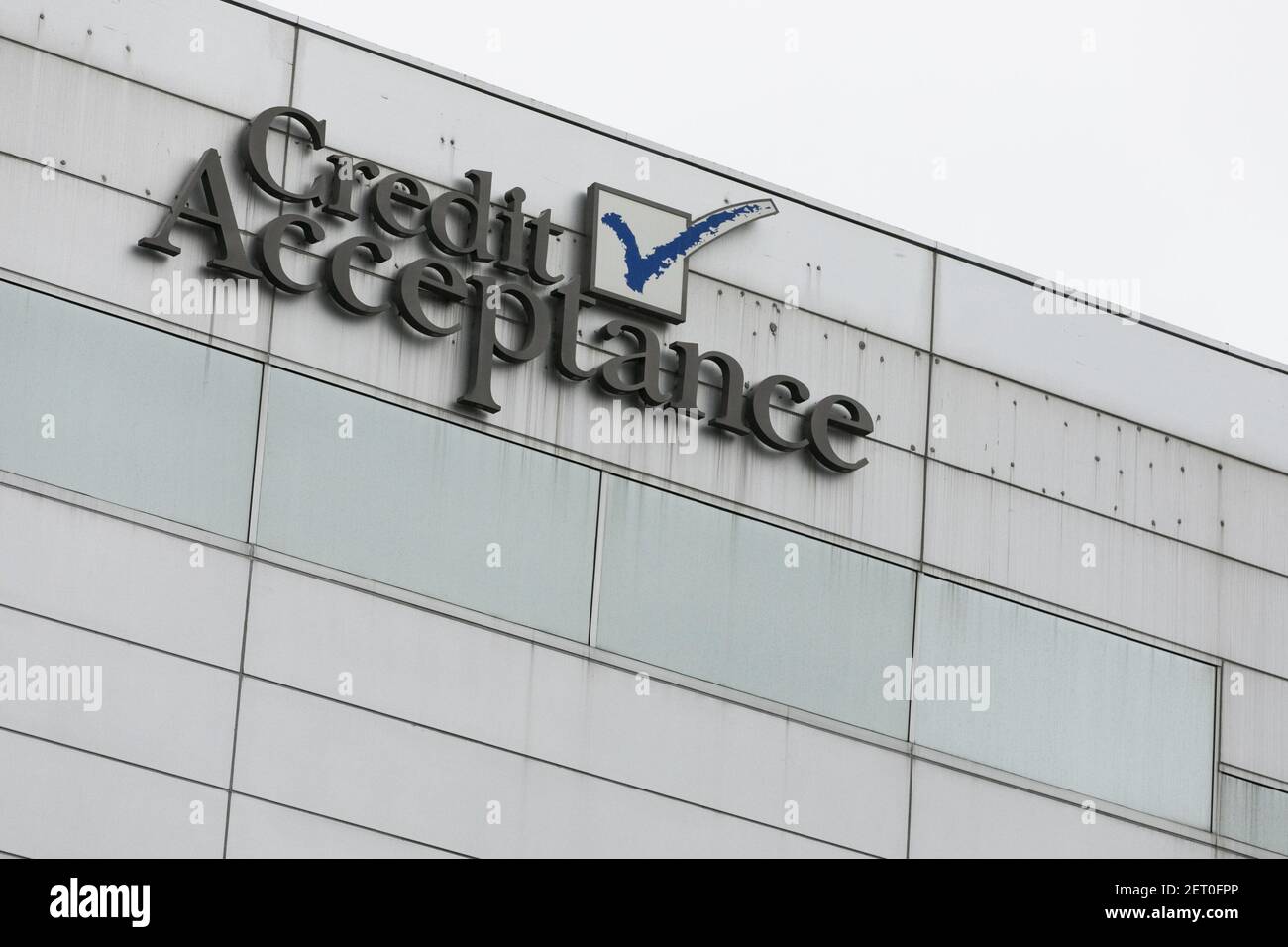 A logo sign outside of the headquarters of the Credit Acceptance ...