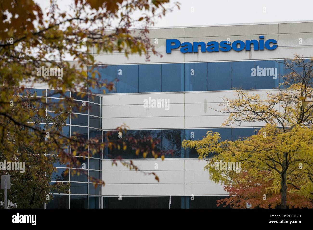 A logo sign outside of a facility occupied by Panasonic Automotive ...