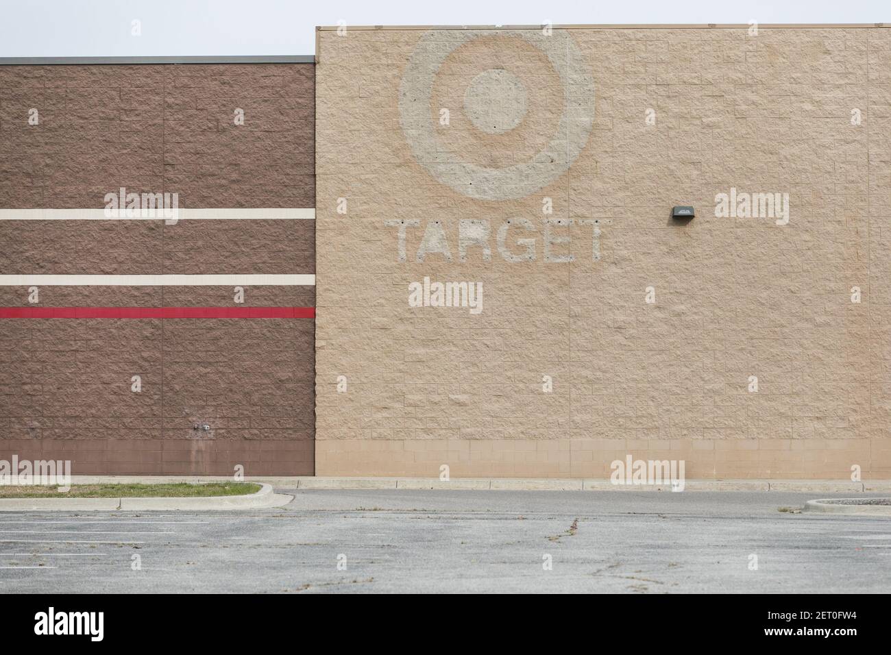 The faded outline of a logo sign outside of a closed Target Corporation ...