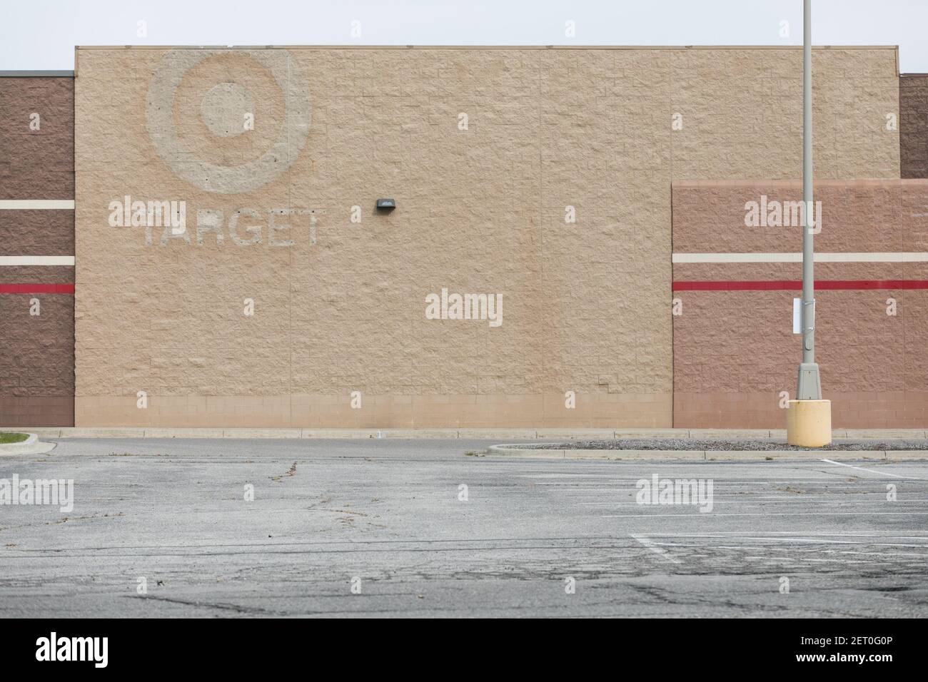 The faded outline of a logo sign outside of a closed Target Corporation ...
